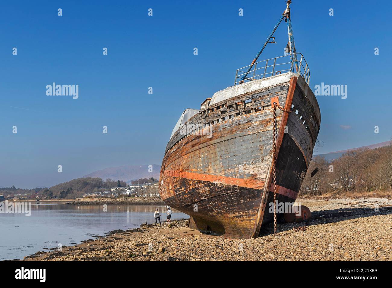 FORT WILLIAM CAOL SCOTLAND TWO PEOPLE AND THE OLD BOAT LYING ABANDONED ...