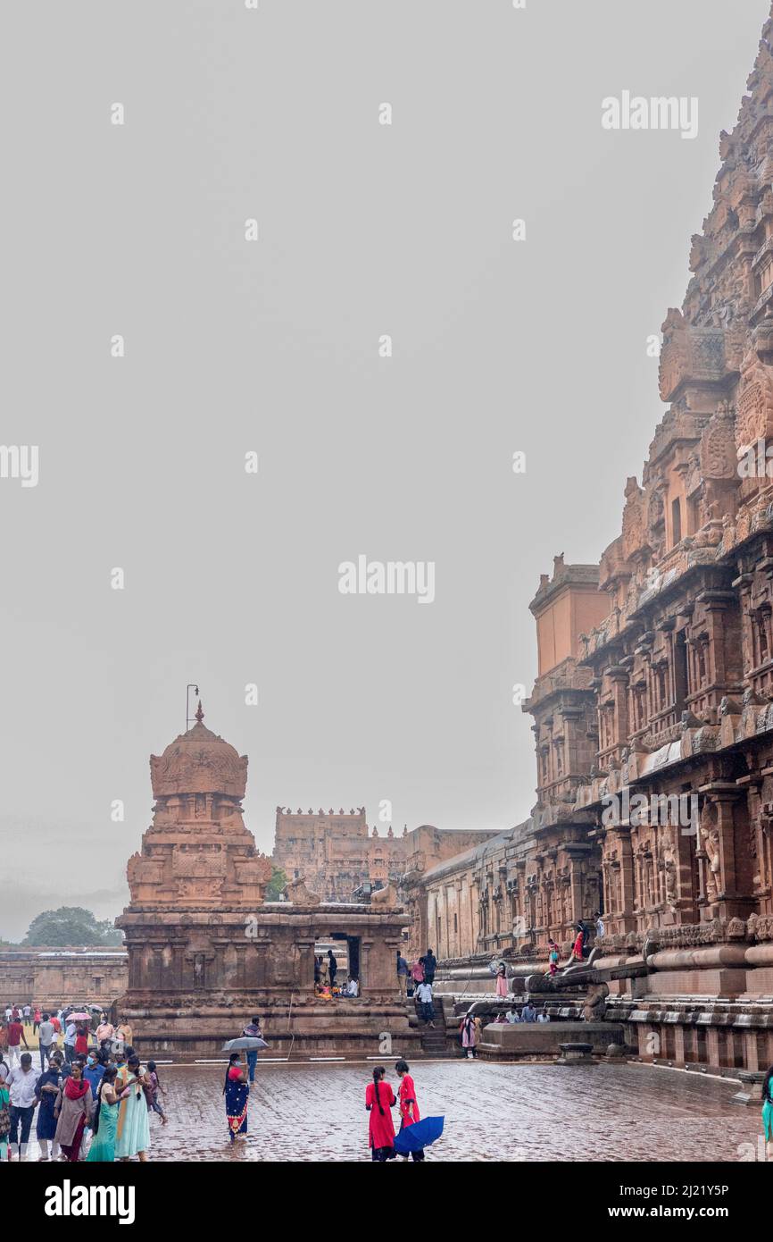A vertical shot of people walking around the Thanjavur Periya Kovil ...