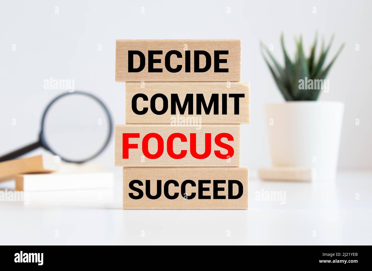 Motivational and inspirational quote - Decide, commit, focus, succeed written on wooden blocks ...