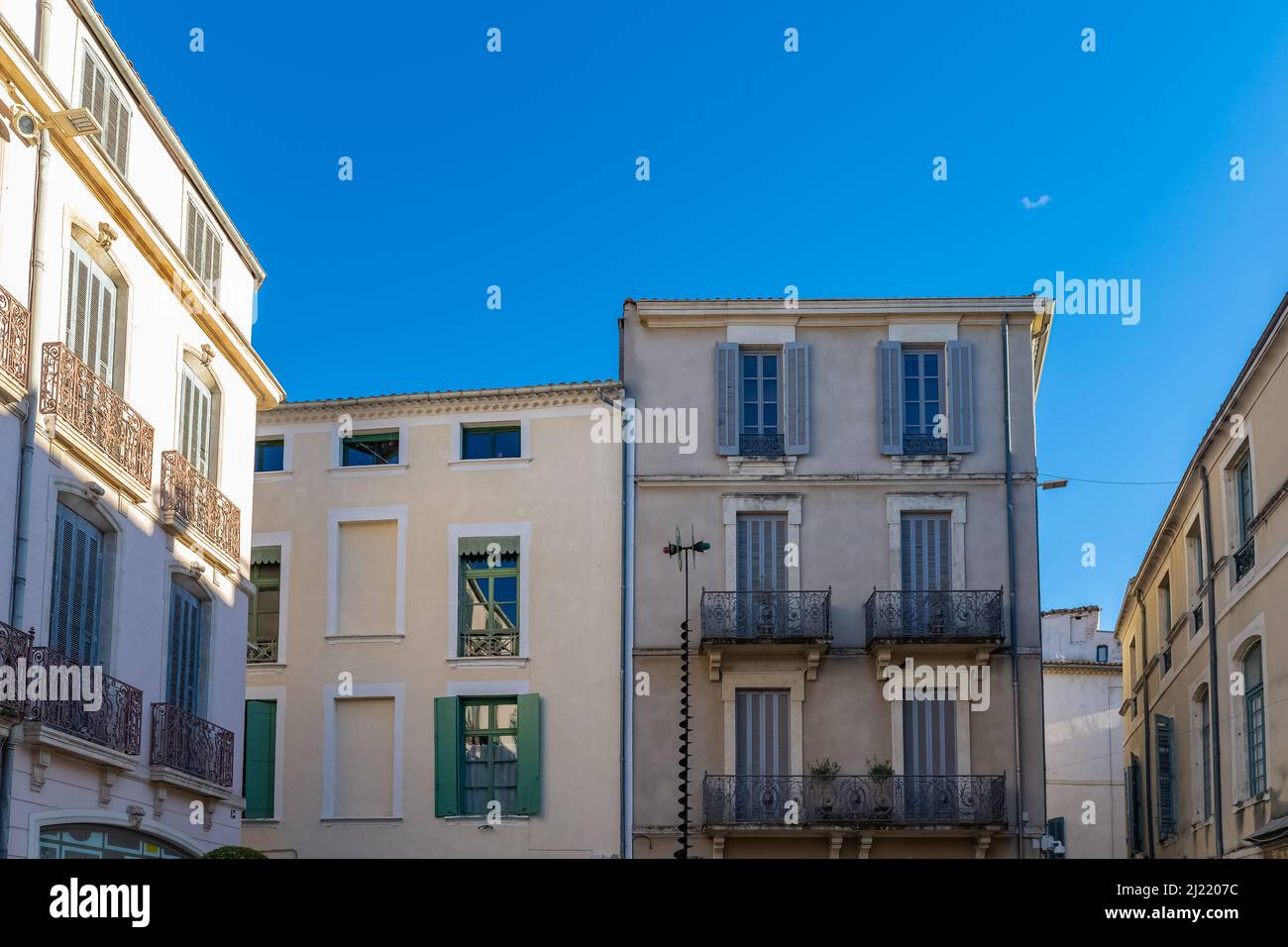 Nimes in Franc, old facades in the historic center, typical buildings ...