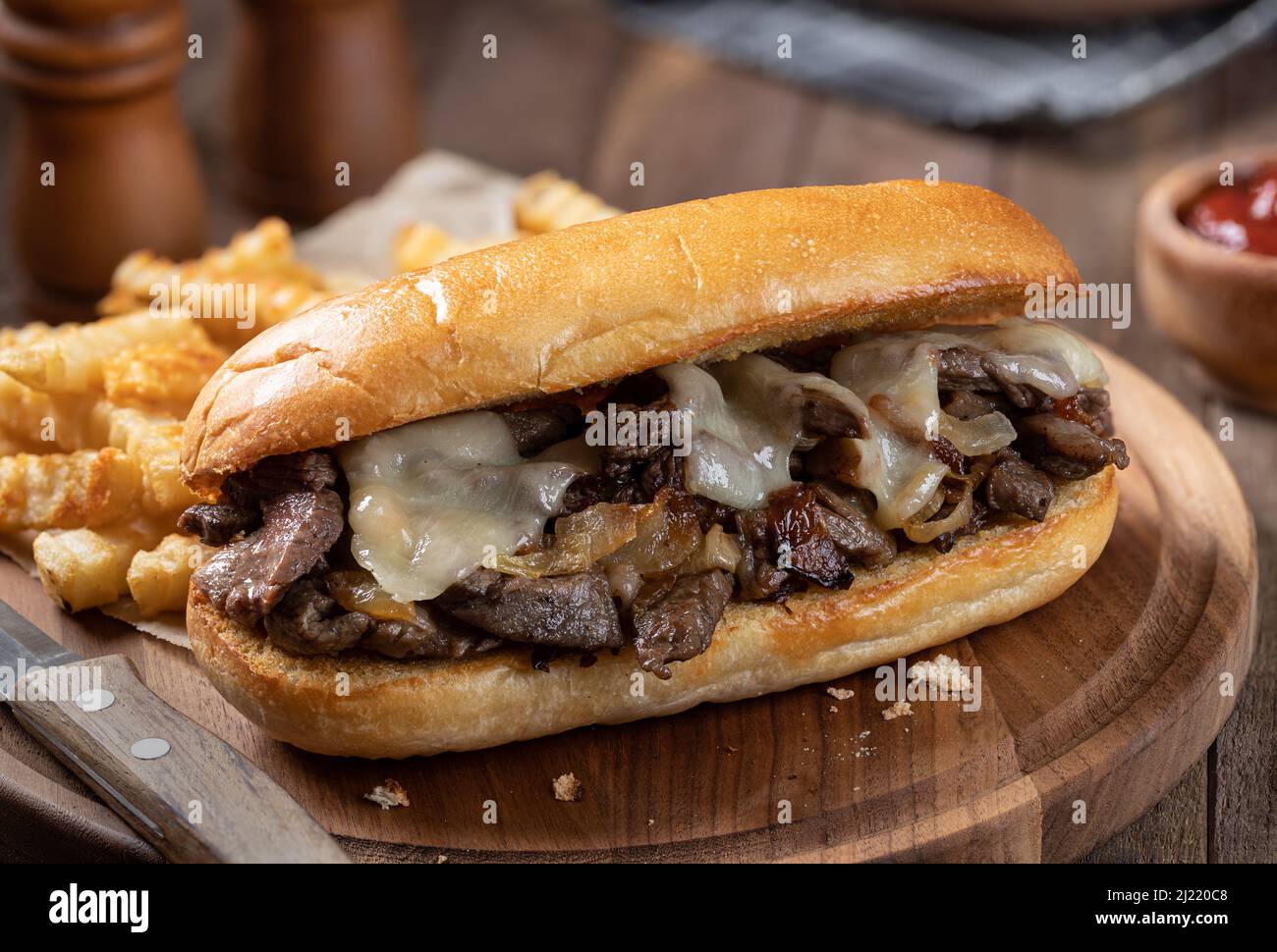 Philly cheesesteak sandwich made with steak, cheese and onions on a ...