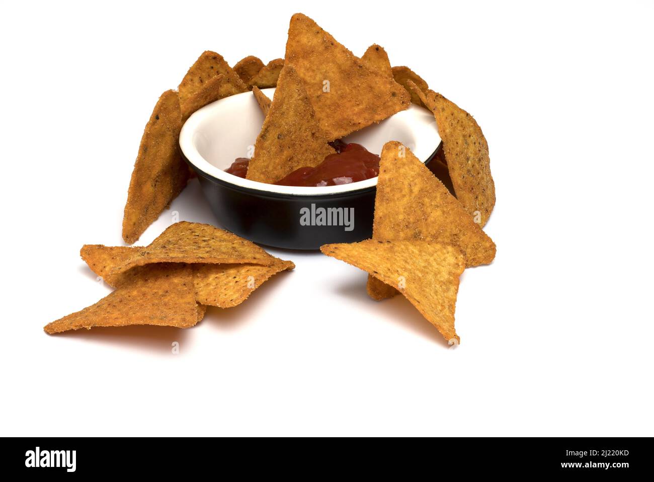 Close up of ceramic bowl with salsa dipping sauce and triangular ...