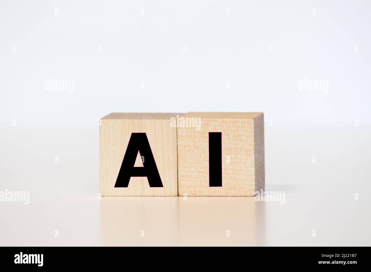 Word AI or Artificial Intelligence concept, written with wood cubes ...