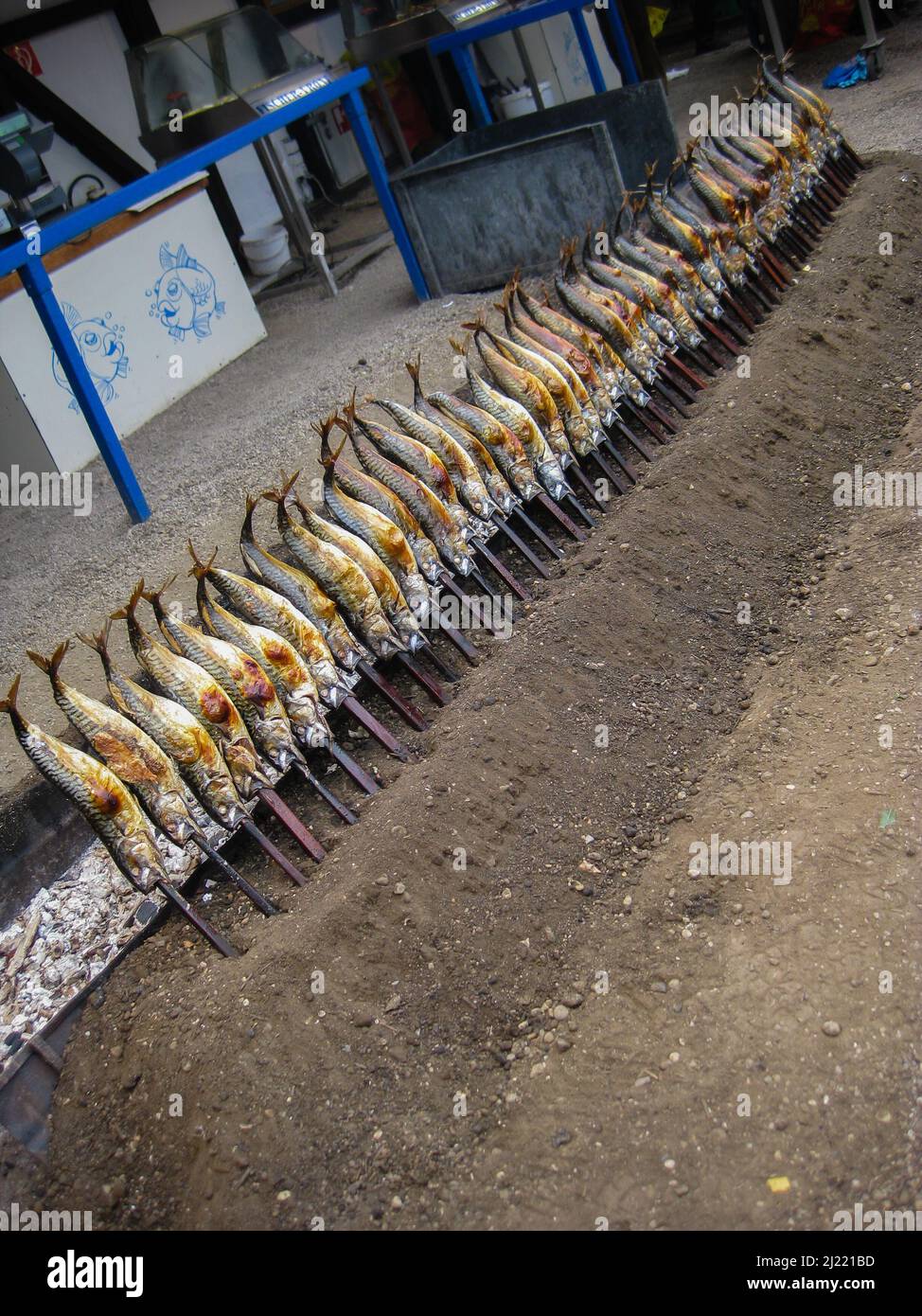 Whole Fish roasted over open coal fire at Munich Oktoberfest Stock ...