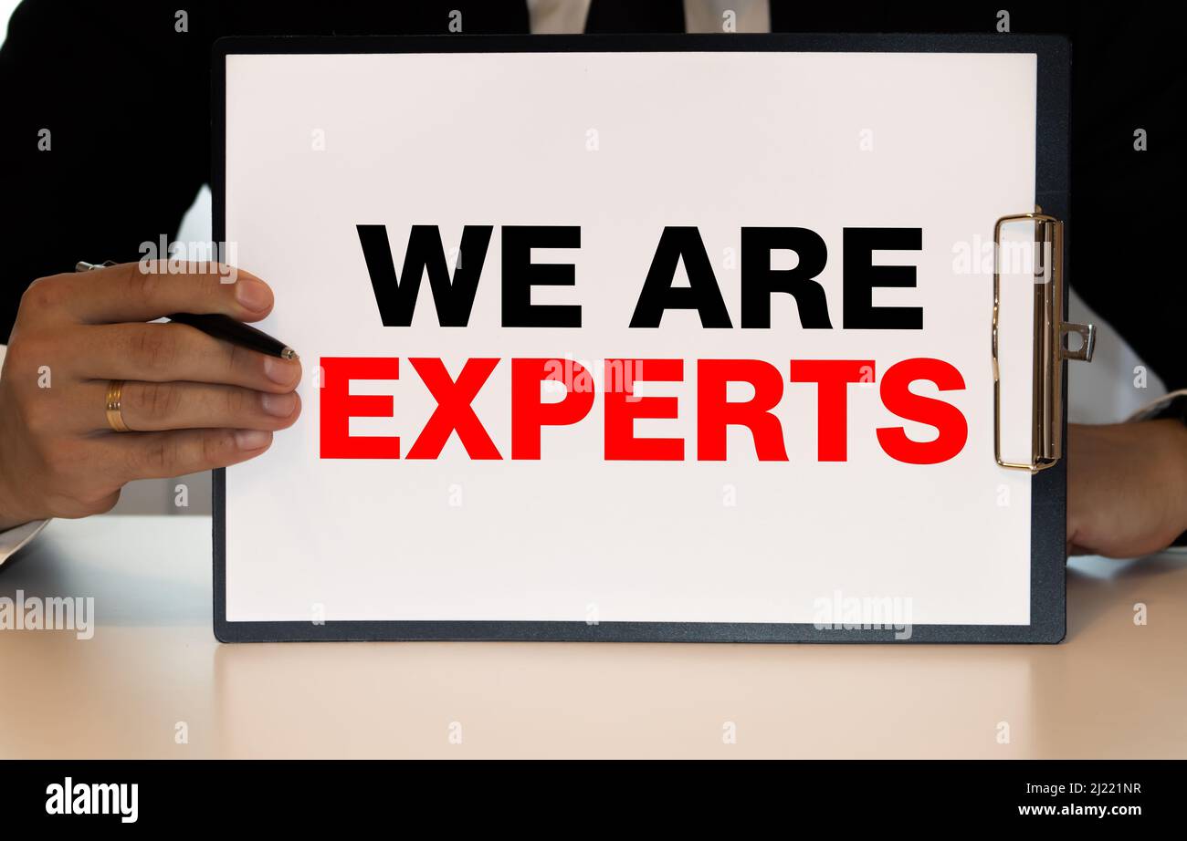 Notepad with text EXPERT ADVICE on business charts and pen Stock Photo ...