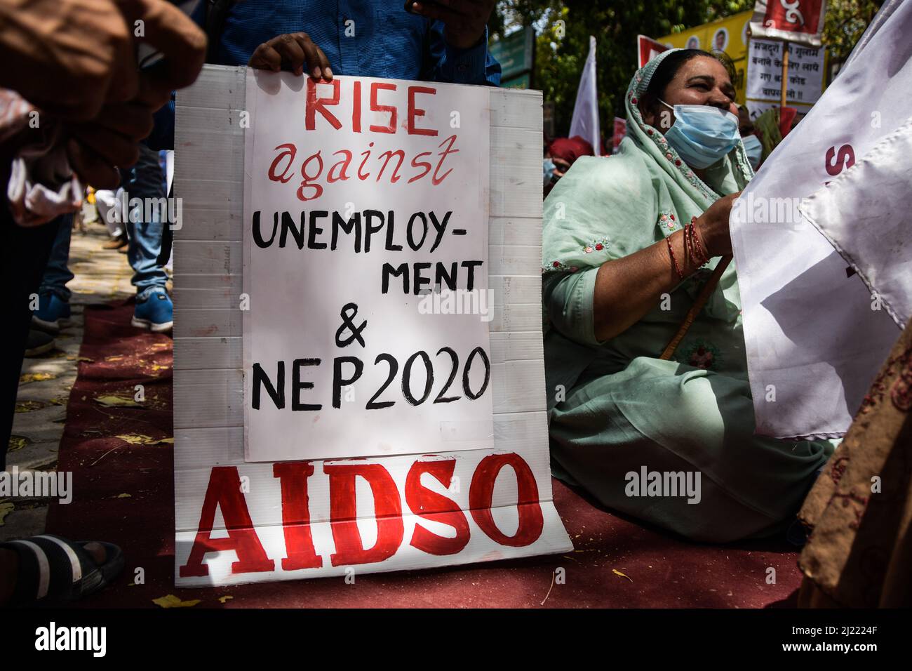 A protester displays a placard expressing his opinion during the United ...
