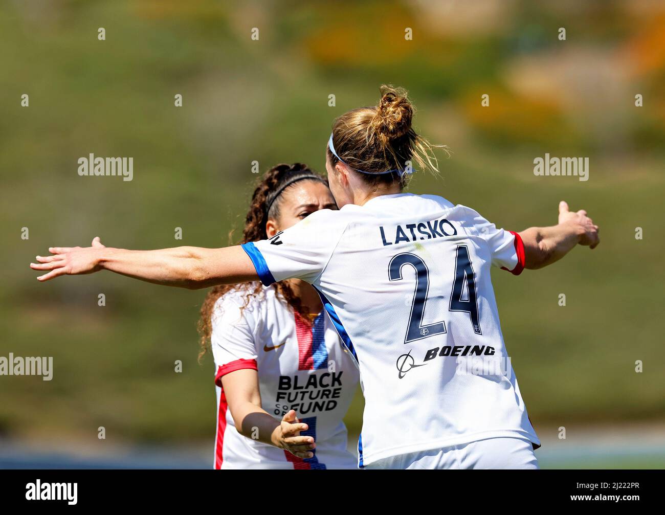 OL Reign Attacker Veronica Latsko (24) embraces OL Reign Midfielder ...