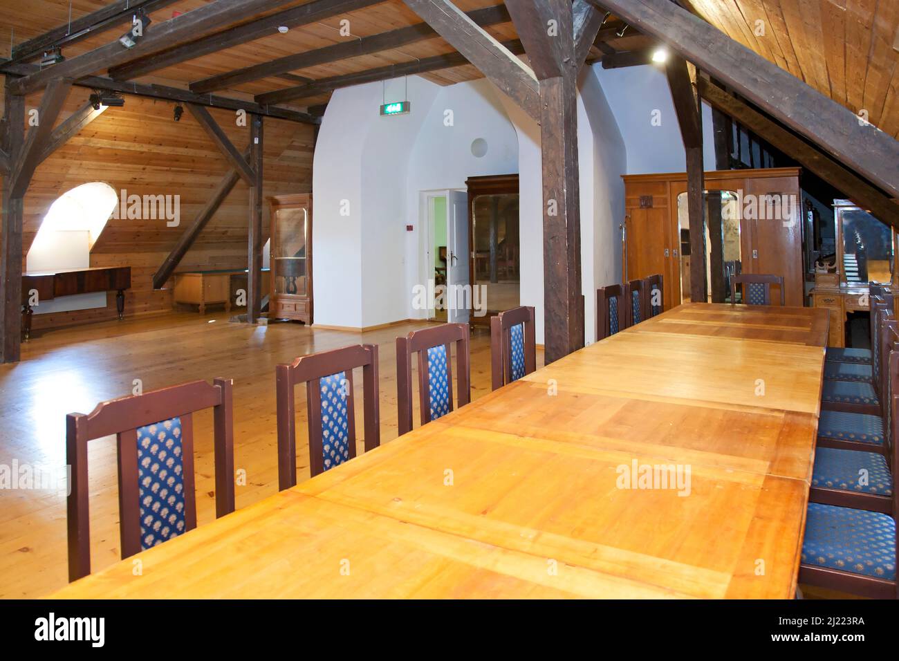 Hallway in a converted farm building, central chimney and mezzanine ...
