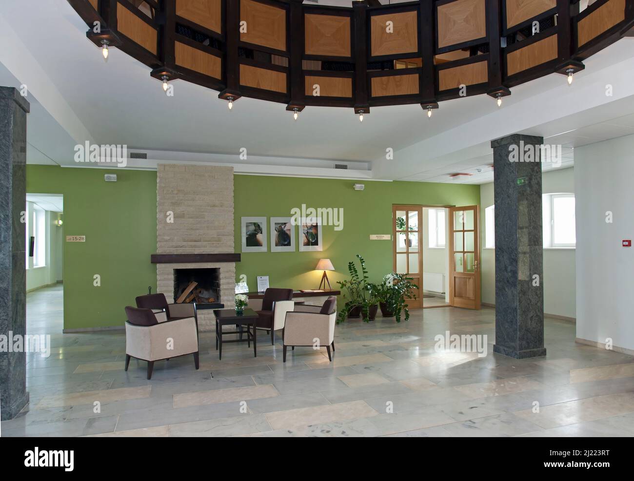 Modern building interior, hotel, reception area, pillars and tiled ...