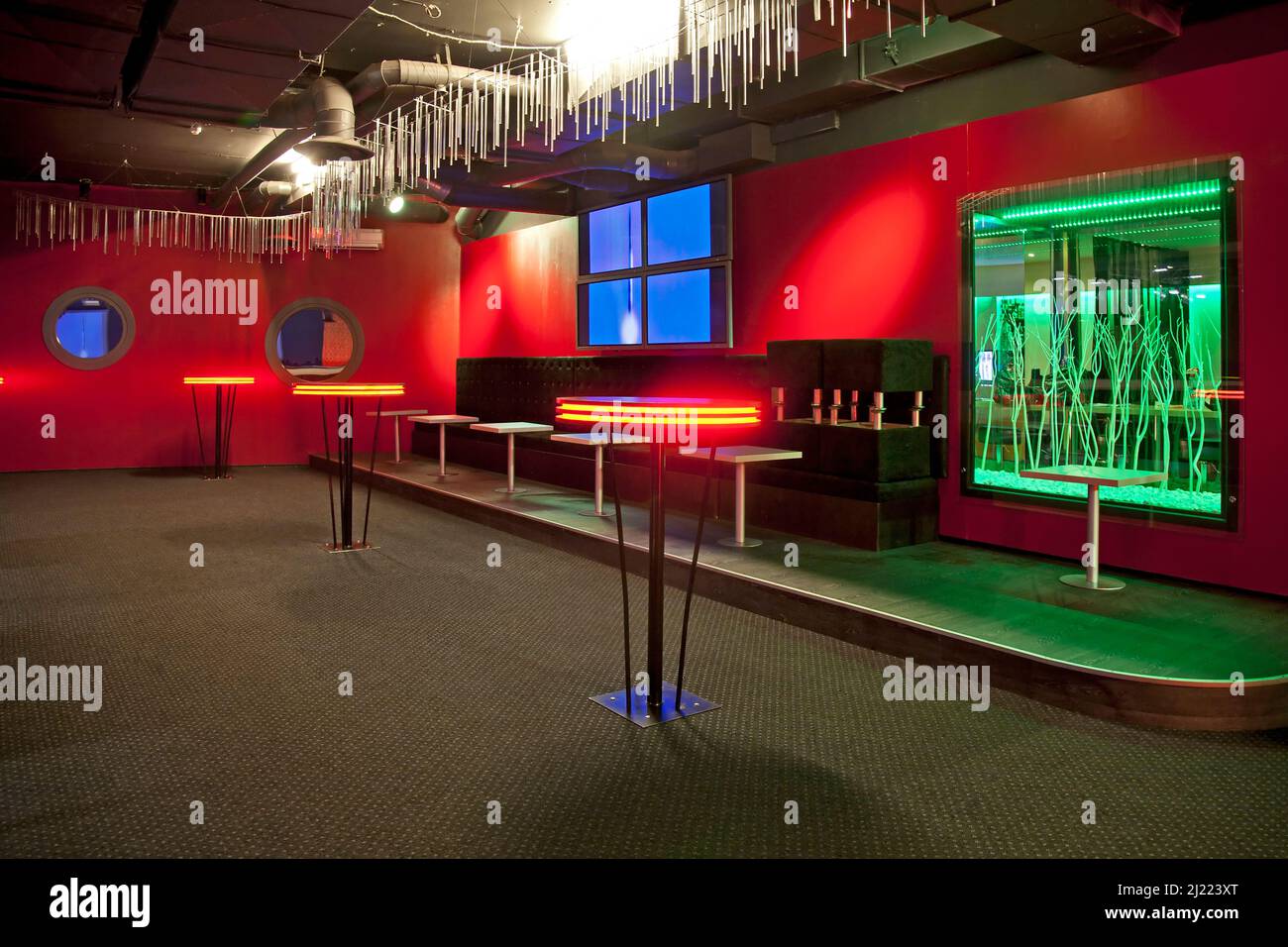 Nightclub interior, hospitality venue and colourful lighting, seatings ...