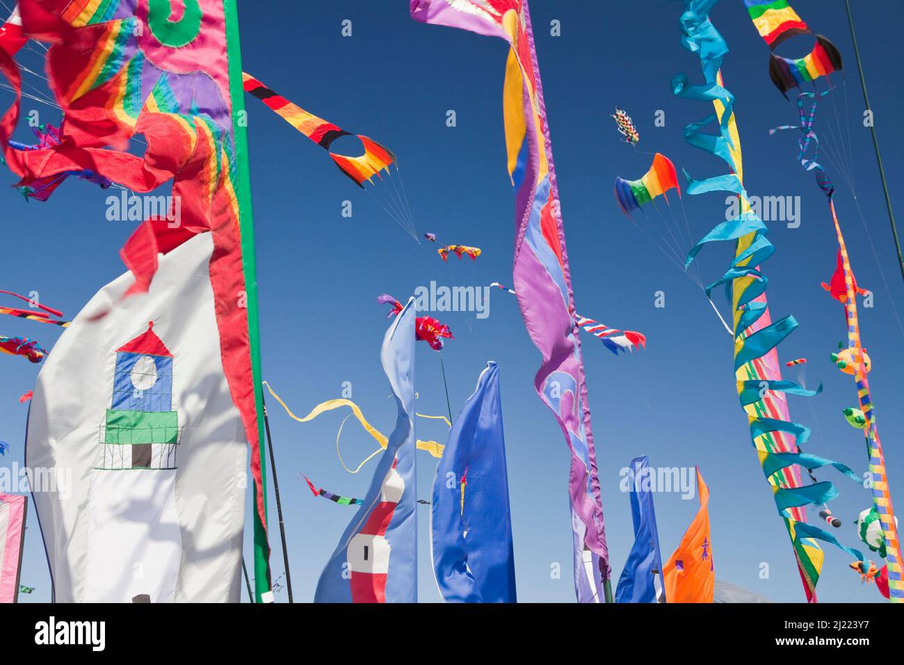 Kites, banners and streamers waving in the wind Stock Photo - Alamy