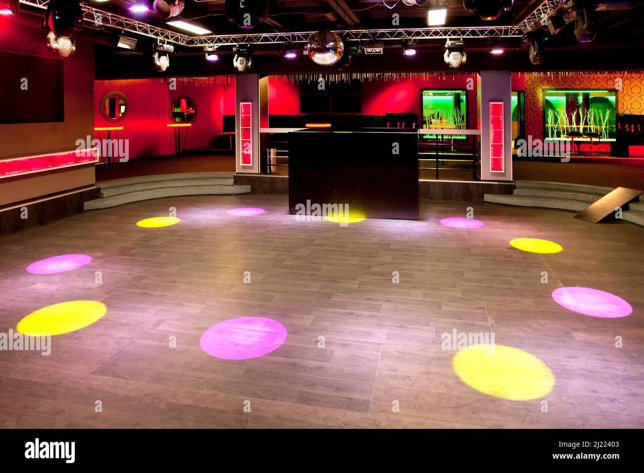Empty nightclub, coloured lights and spots, screens and DJ decks Stock ...
