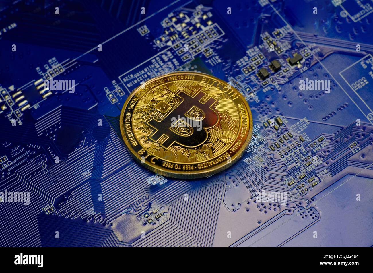 Golden bitcoin cryptocurrency new version on computer electronic circuit board background Stock ...