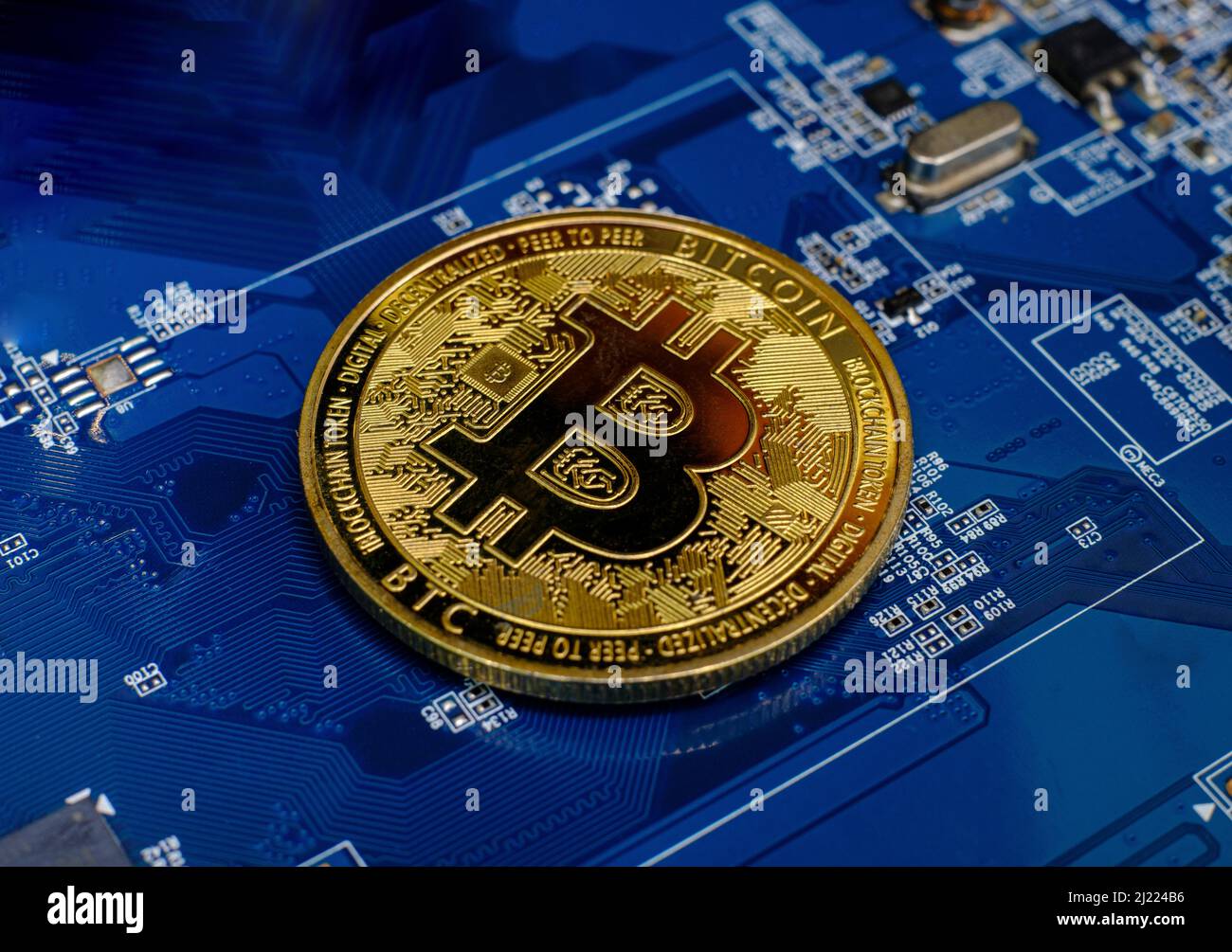 Golden bitcoin cryptocurrency new version on computer electronic circuit board background Stock ...