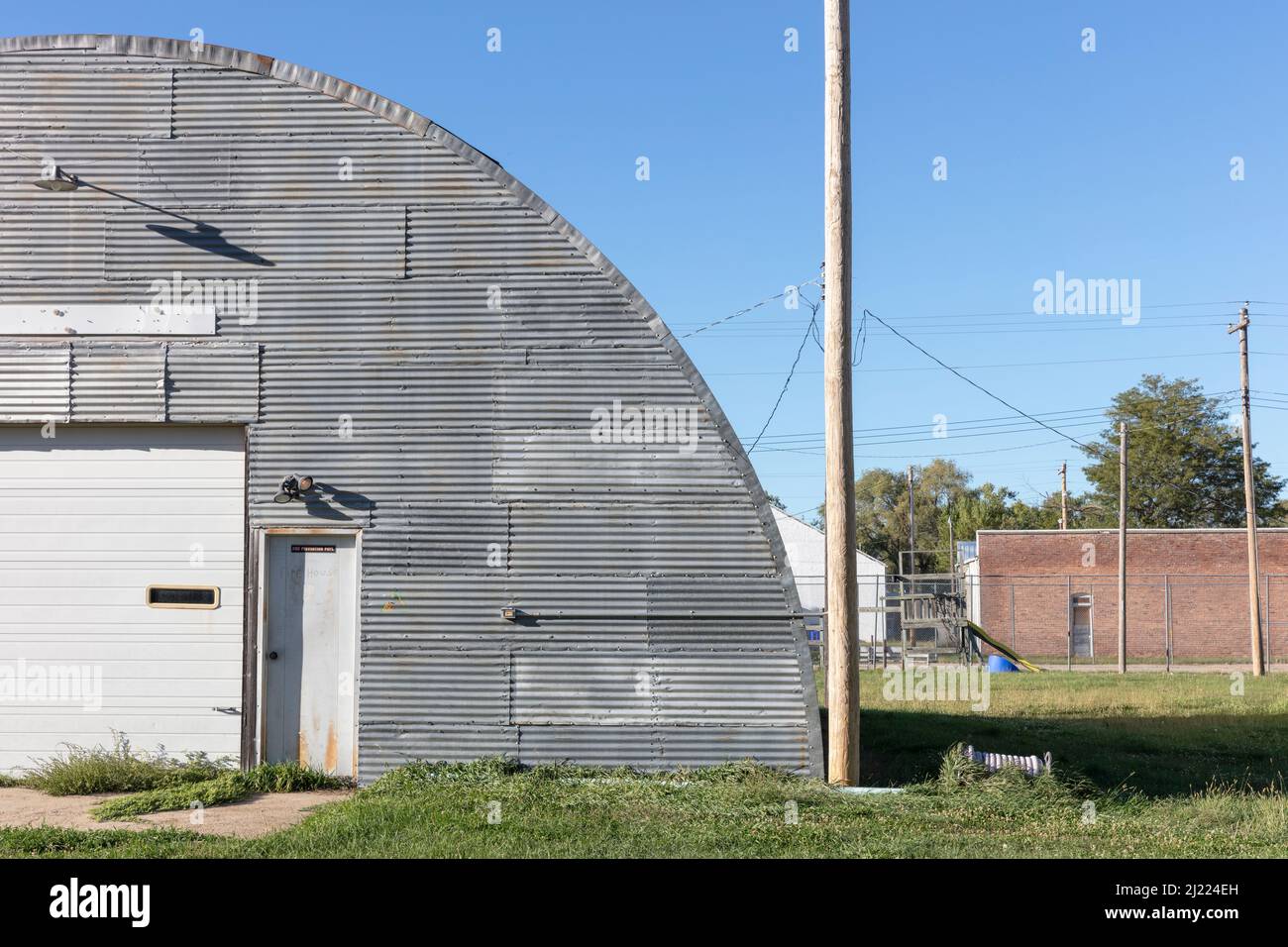 A grey metal barn on a roadside in a small town in Nebraska Stock Photo ...
