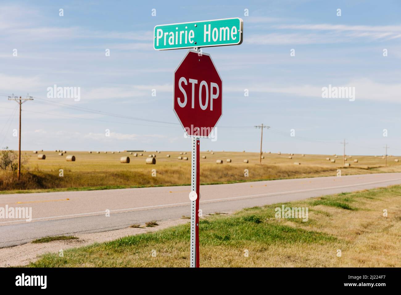 Prairie Home sign and stop sign at the side of a road Stock Photo - Alamy