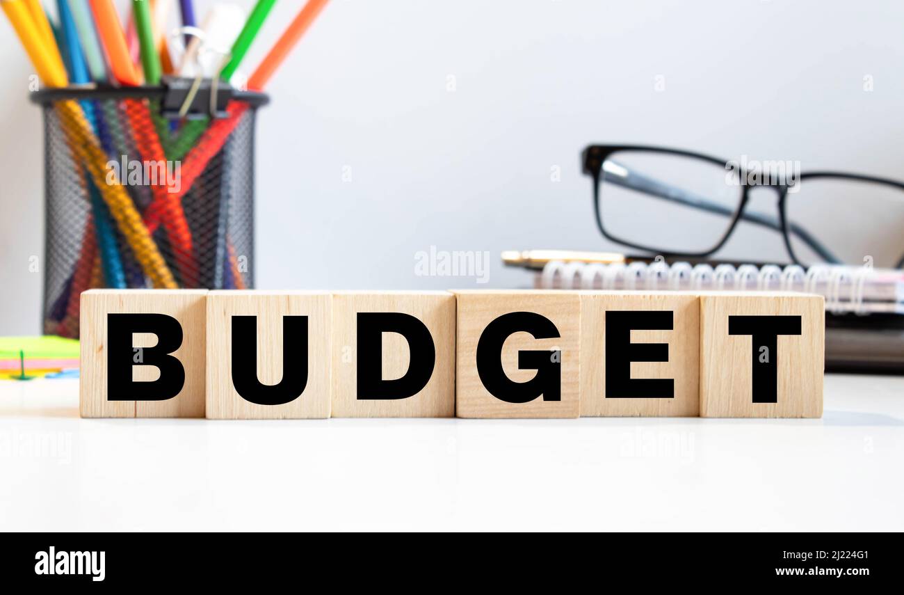 budget word written on wood block, concept Stock Photo - Alamy