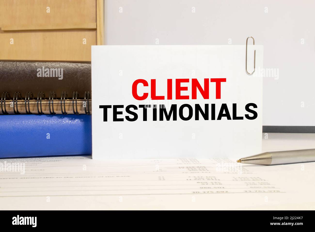 TEXT client testimonials written in a card Stock Photo - Alamy