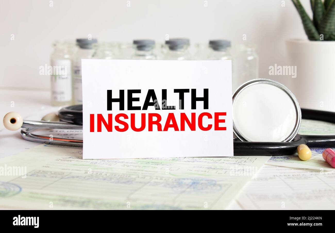 Torn paper with health insurance text. Health insurance concept Stock ...