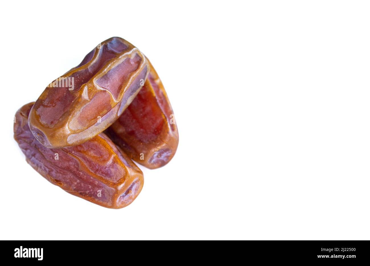 Closeup photo of dried dates isolated on white background Stock Photo ...