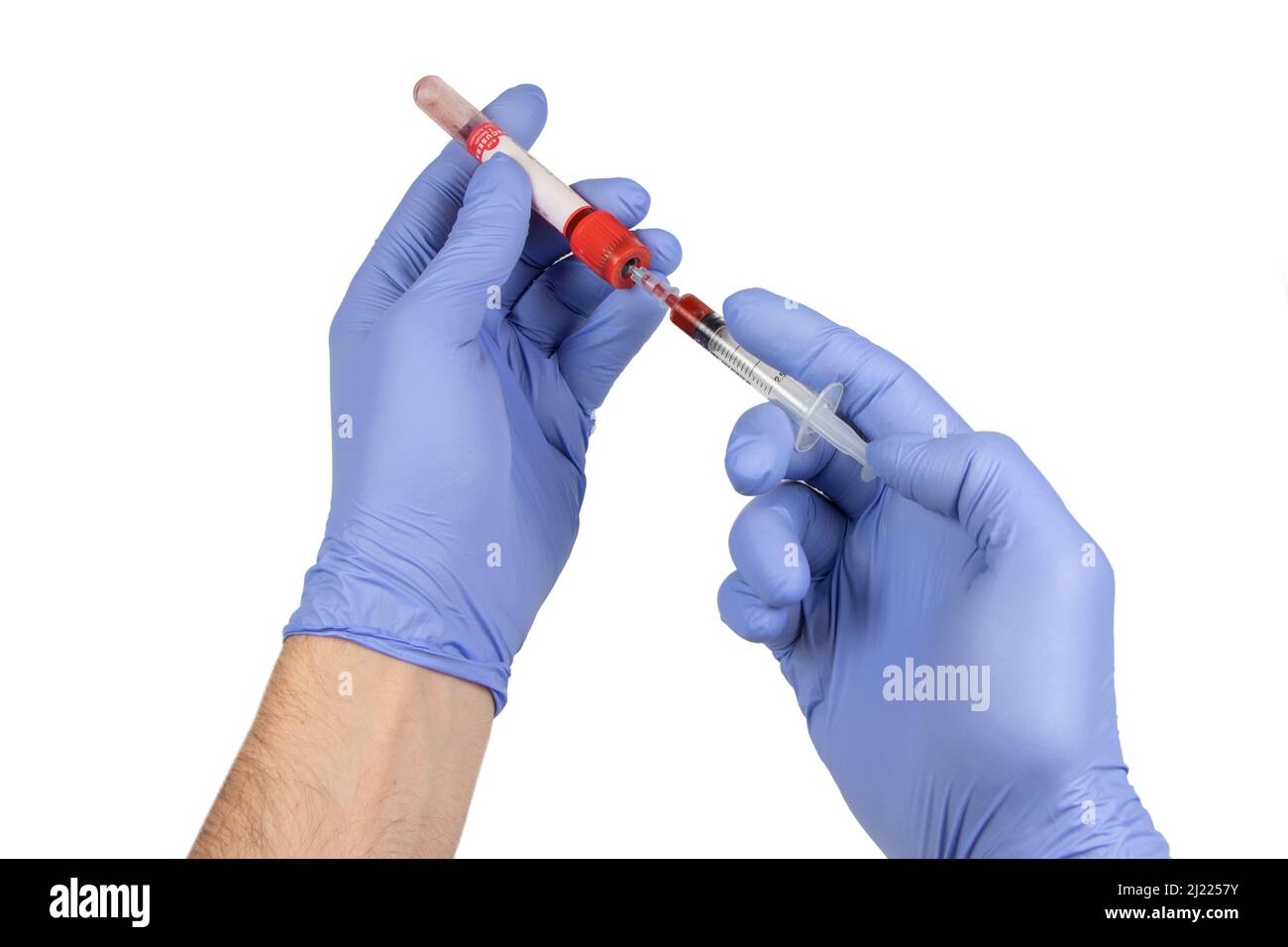 Doctor injecting a blood sample in a test tube analysis Stock Photo - Alamy