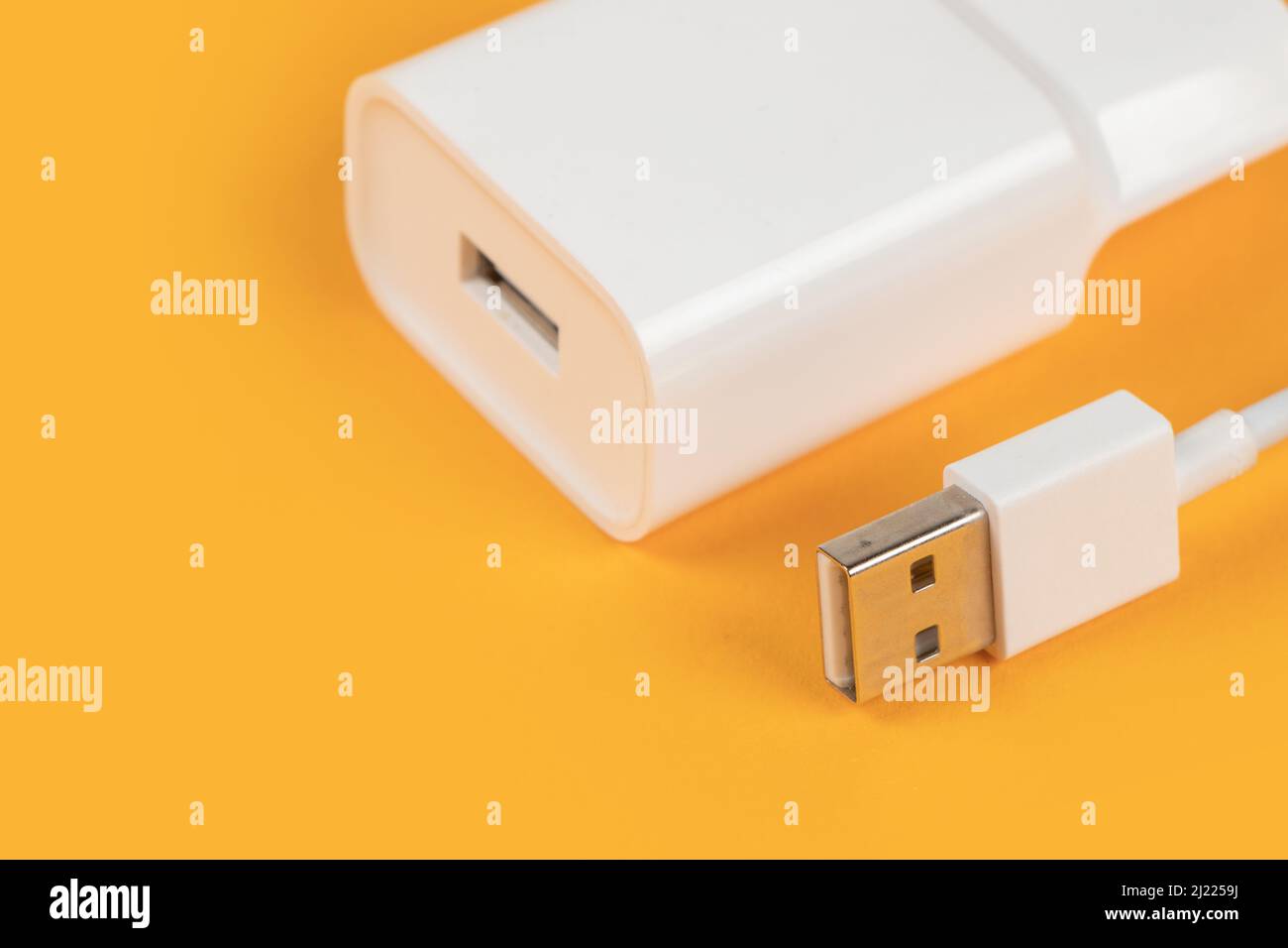 Usb cable with usb connector on yellow background Stock Photo - Alamy