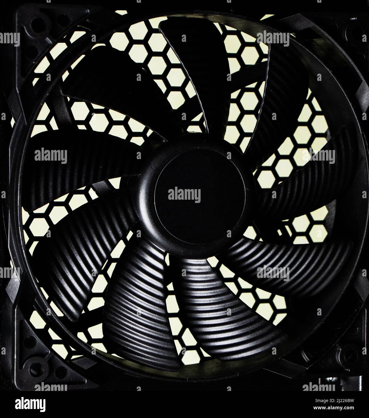 Cose up of computer fan on a dark background Stock Photo - Alamy