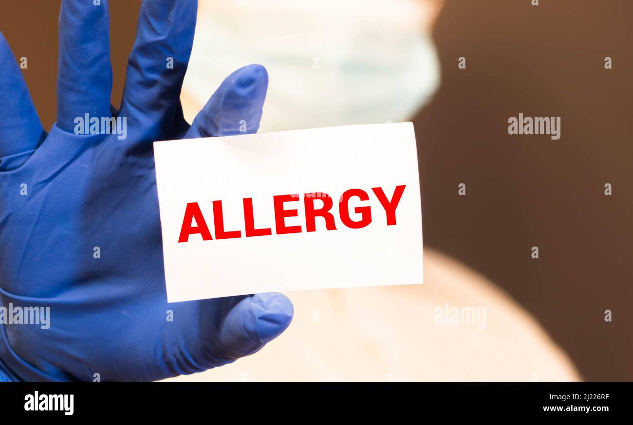 doctor showing a signboard with the word allergy written in it Stock ...