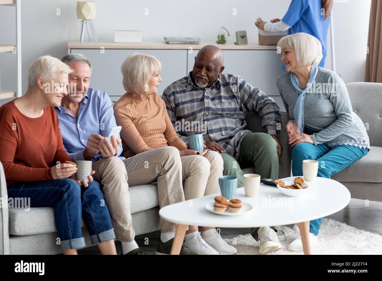 Multiracial group of cheerful elderly people chilling together Stock ...