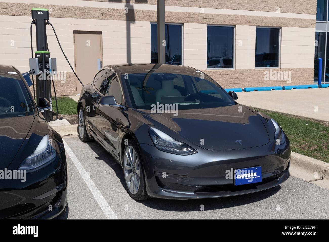 Naperville - Circa March 2022: CarMax Auto Dealership Tesla display ...