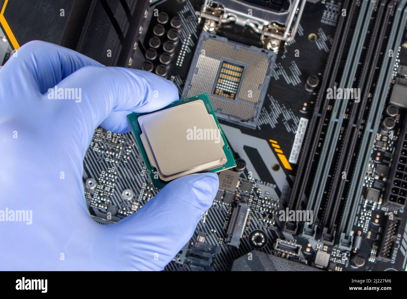 Plug in CPU microprocessor to motherboard socket. Technological background. Concept computers ...