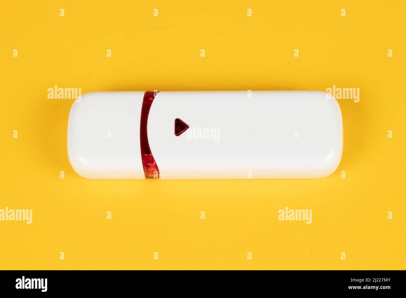 USB flash drive on yellow background Stock Photo - Alamy
