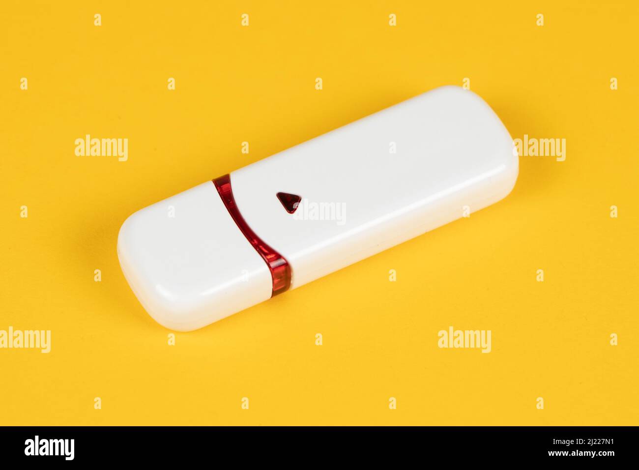 USB flash drive on yellow background Stock Photo - Alamy