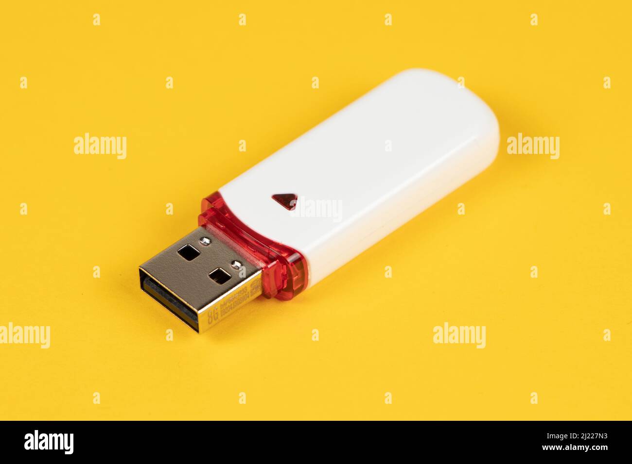 USB flash drive on yellow background Stock Photo - Alamy