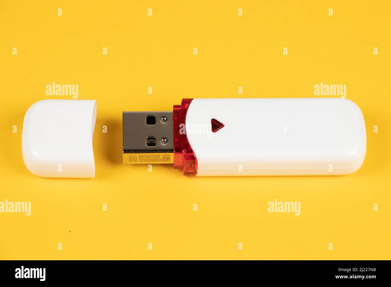 USB flash drive on yellow background Stock Photo - Alamy