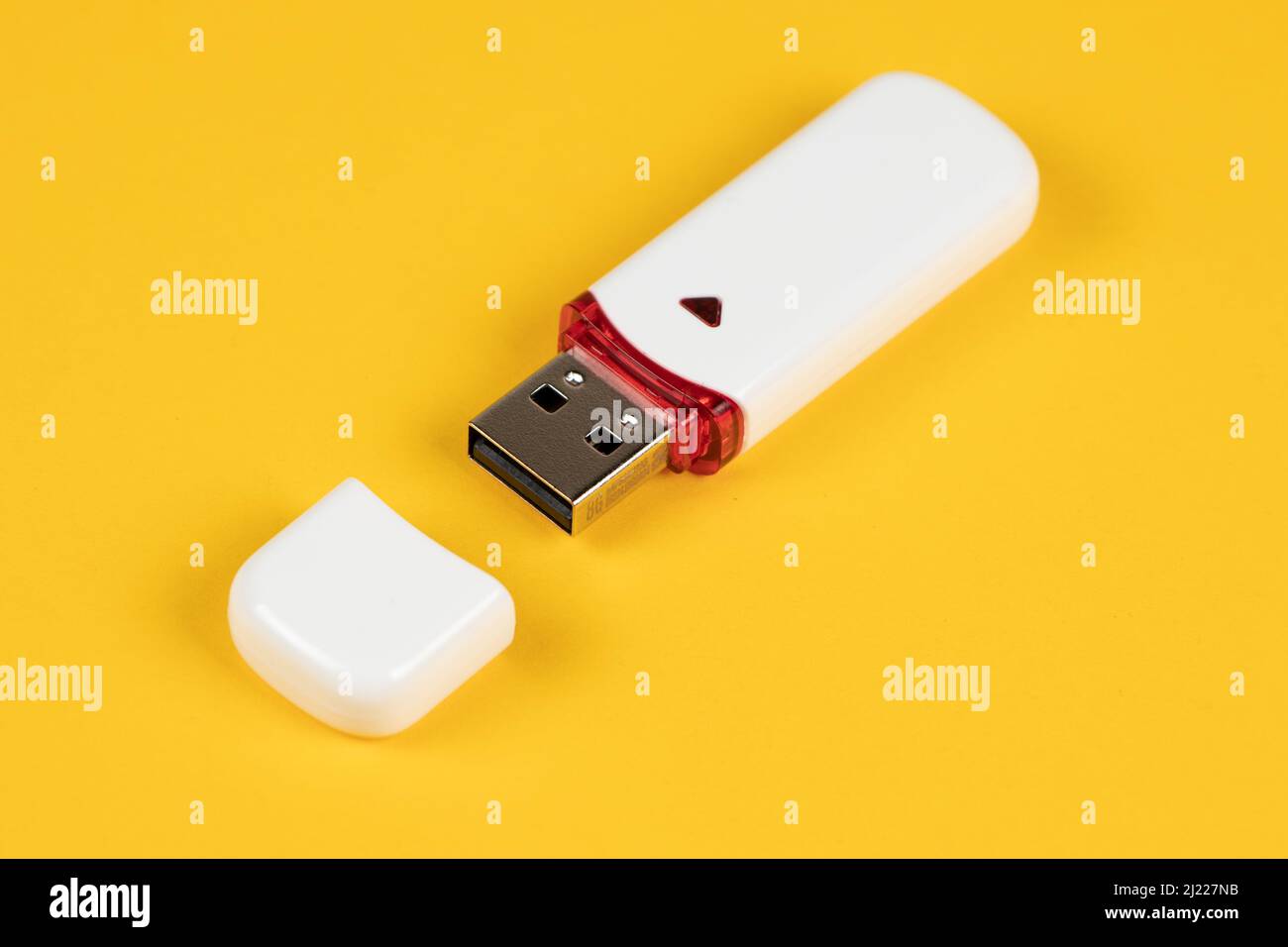 USB flash drive on yellow background Stock Photo - Alamy