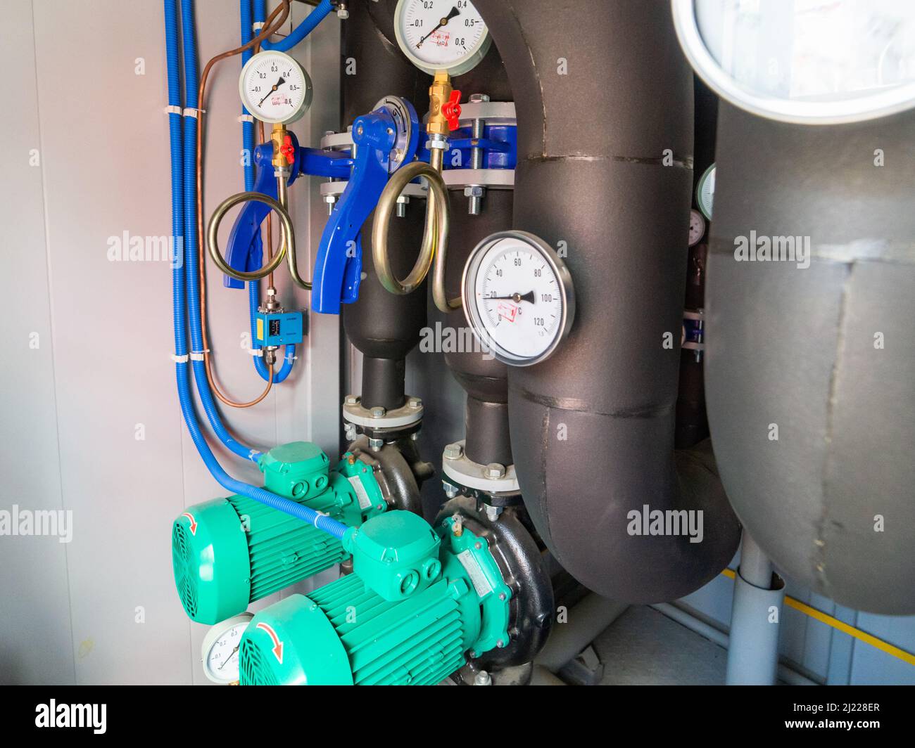 Industrial interior of water pump, valves, pressure gauges, motors ...