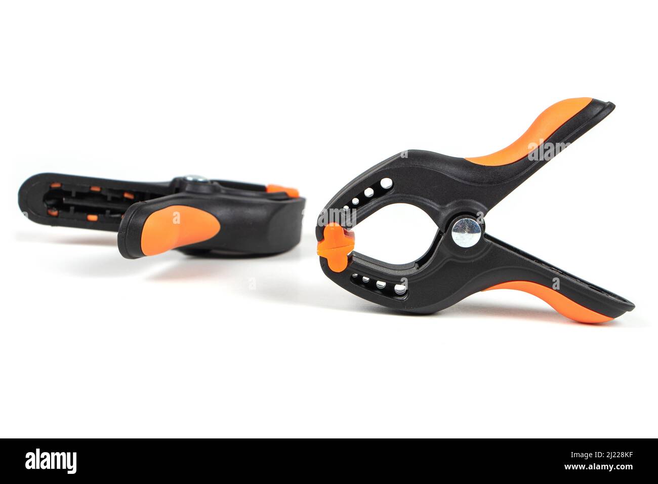 Plastic spring clamp isolated on white background. Clamping equipment ...