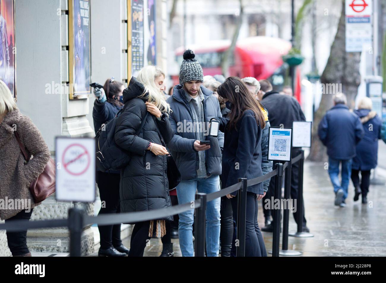 People queue outside the Garrick Theatre in London after the relaxation ...