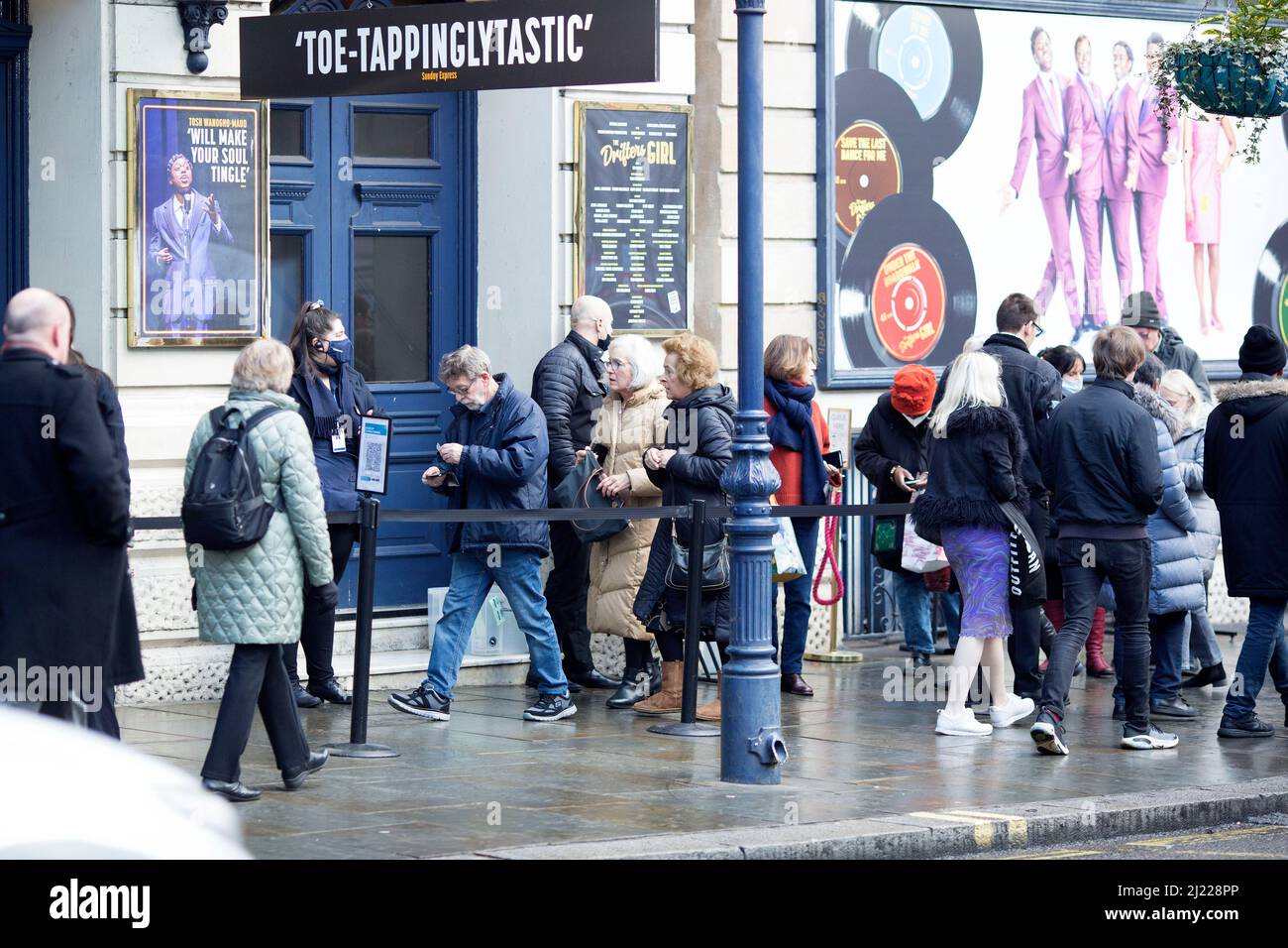 People queue outside the Garrick Theatre in London after the relaxation ...
