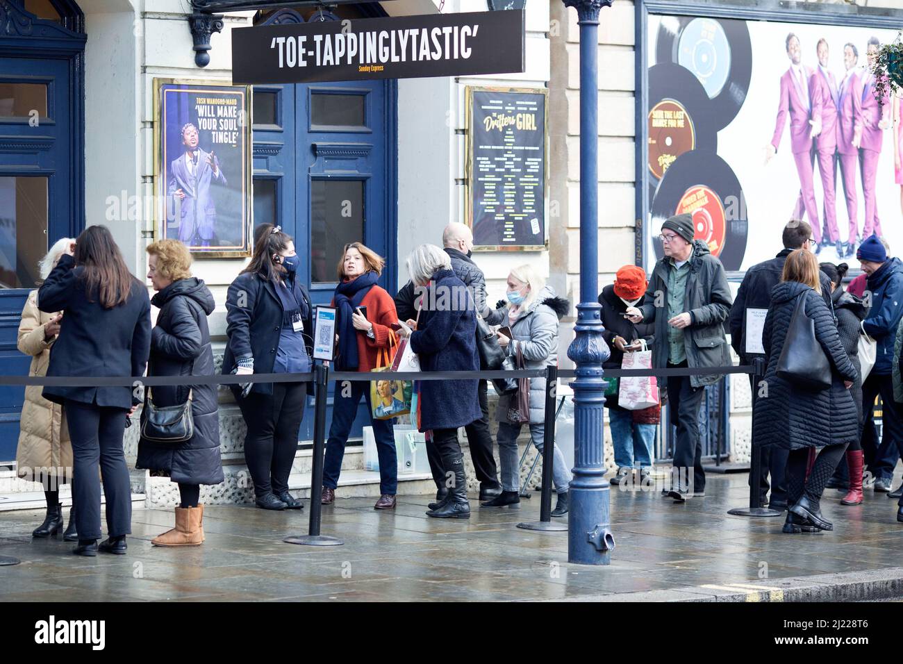 People queue outside the Garrick Theatre in London after the relaxation ...