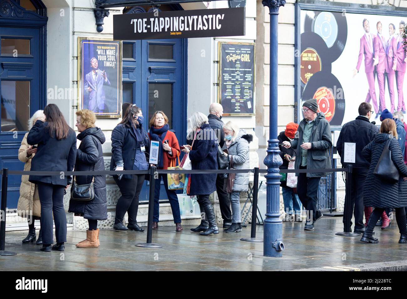 People queue outside the Garrick Theatre in London after the relaxation ...