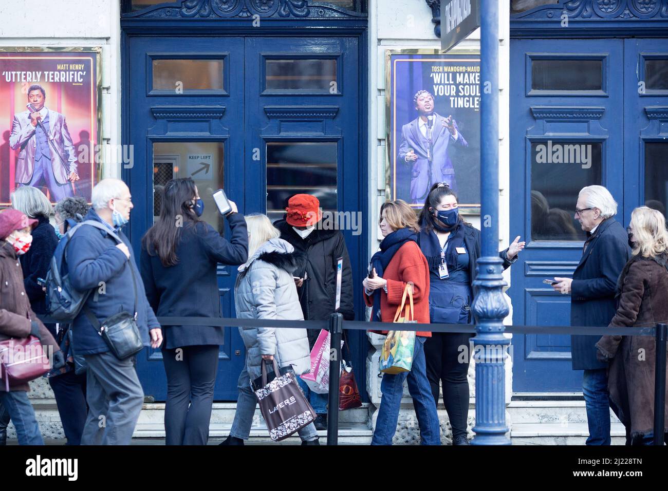 People queue outside the Garrick Theatre in London after the relaxation ...