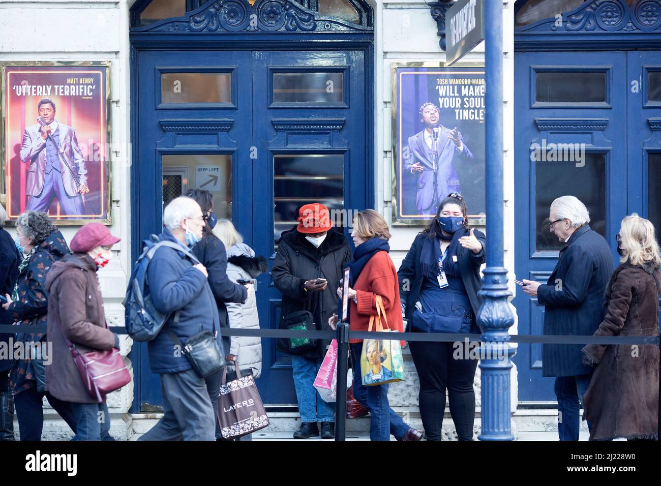 People queue outside the Garrick Theatre in London after the relaxation ...