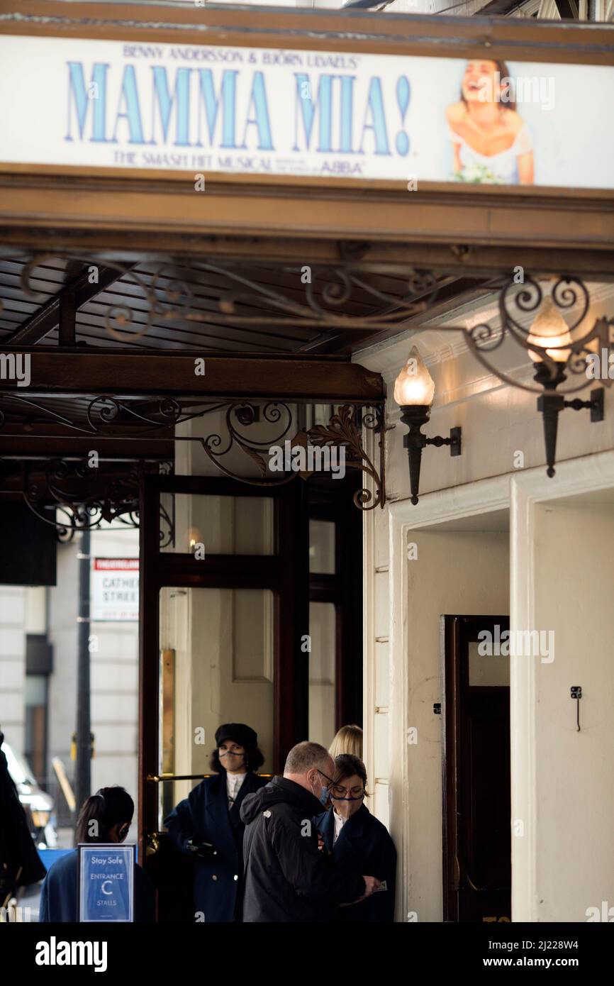 People queue outside the Novello Theatre in London after the relaxation ...