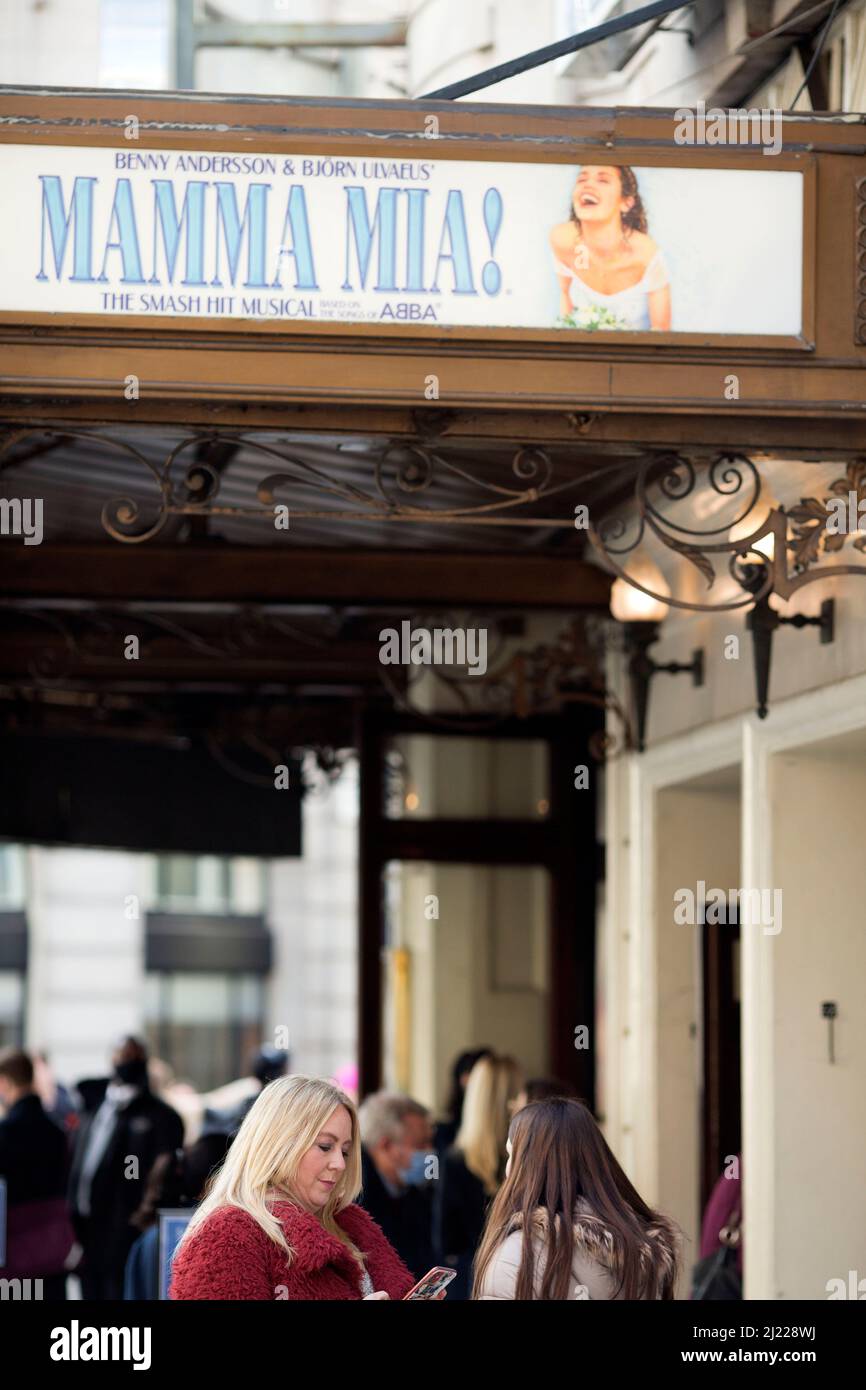 People queue outside the Novello Theatre in London after the relaxation ...
