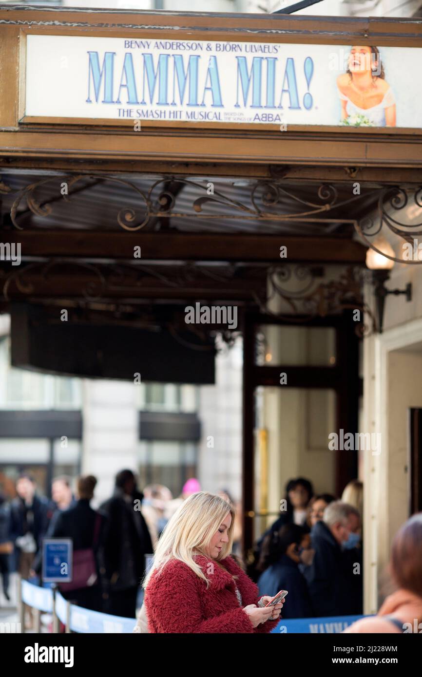 People queue outside the Novello Theatre in London after the relaxation ...