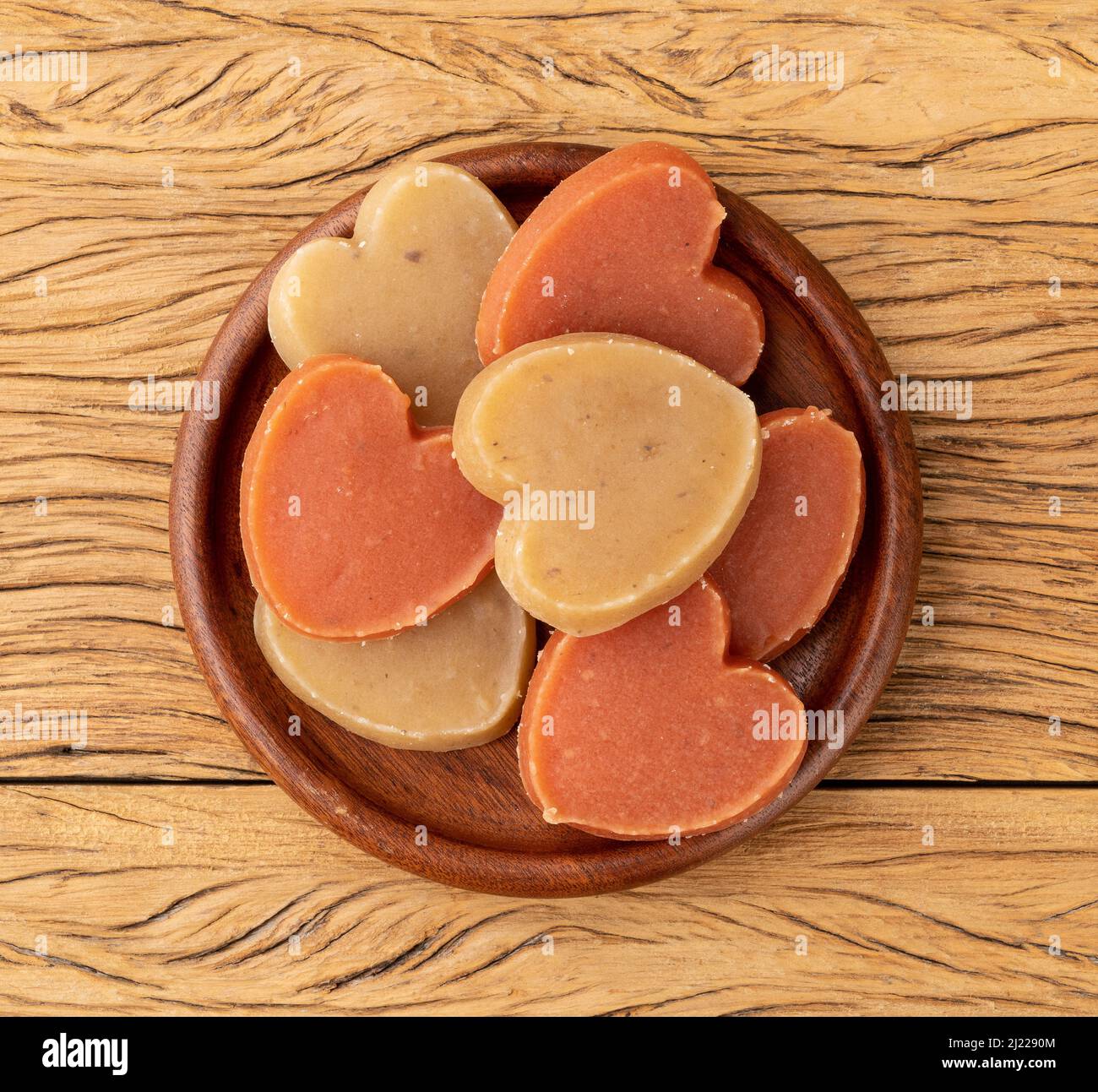Sweet potato candy, typical brazilian june festival food over wooden ...