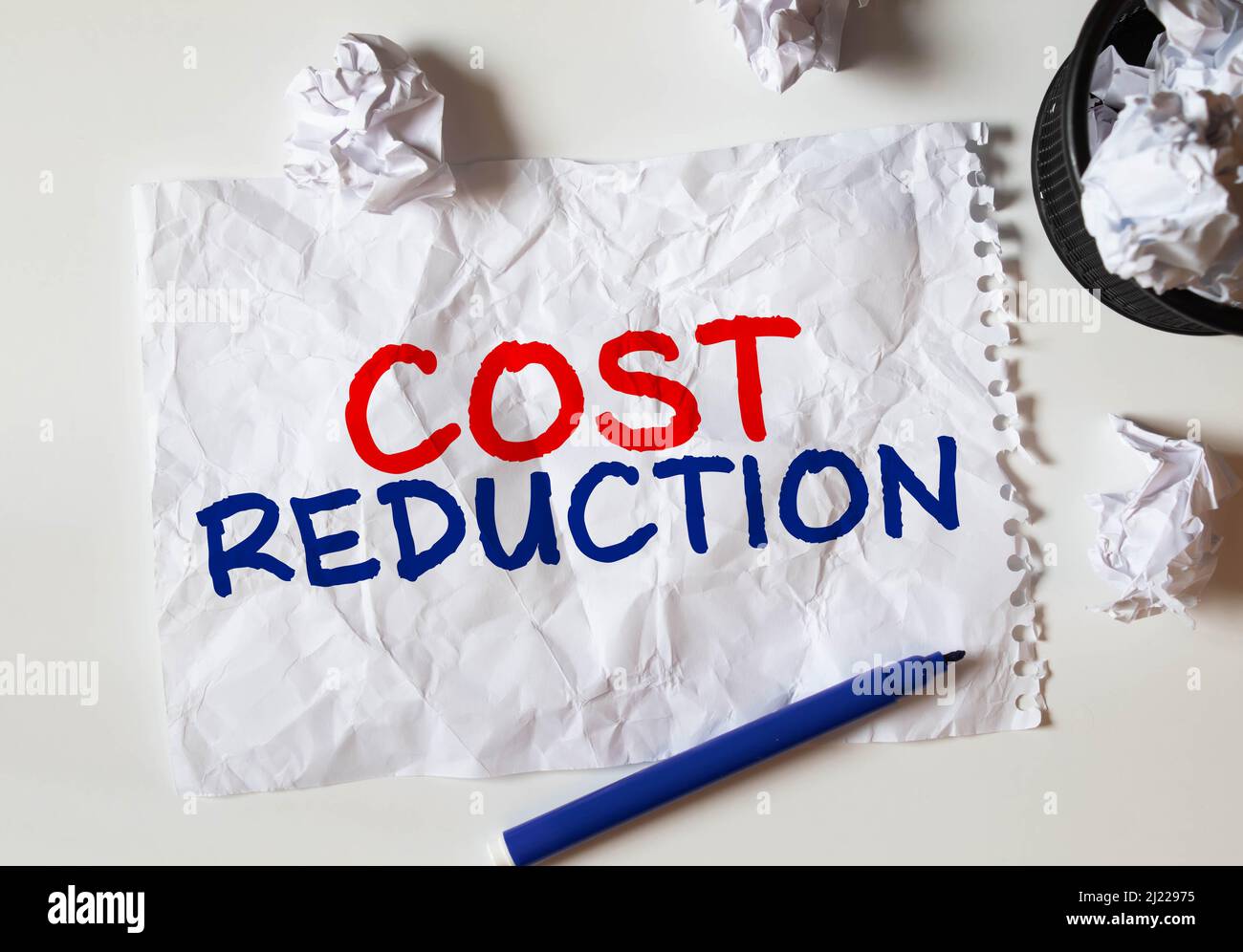 Cost Reductions words on copybook page, Business concept for reduction ...