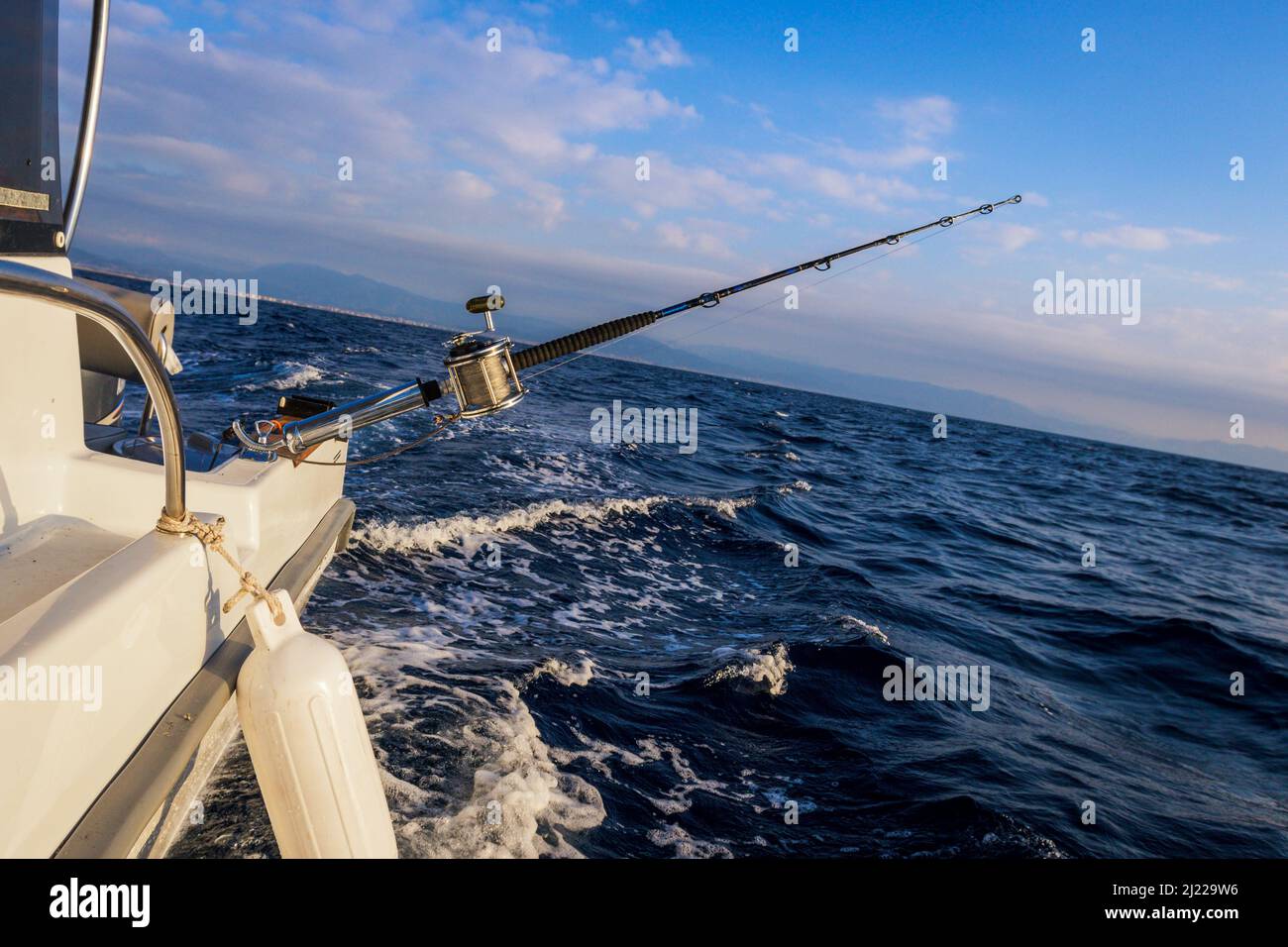 Rod with the coil fixed onboard the vessel Stock Photo - Alamy